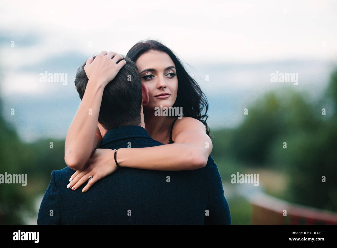 man holding his girlfriend on hands Stock Photo - Alamy