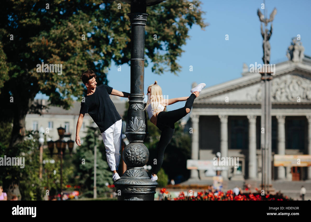 man and woman performing acrobatic tricks Stock Photo - Alamy