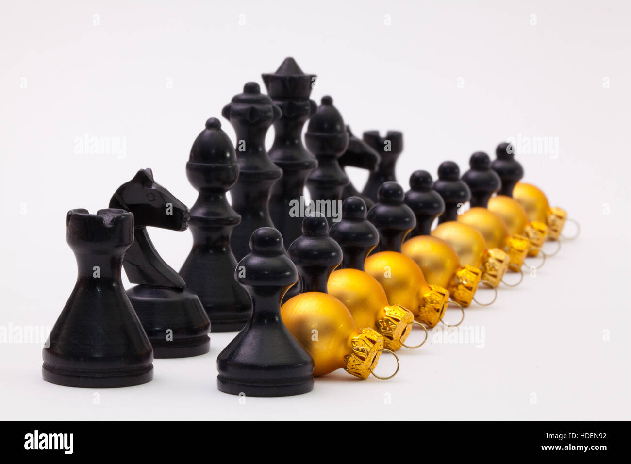 Black chess figure and golden Christmas decoration on the white ...