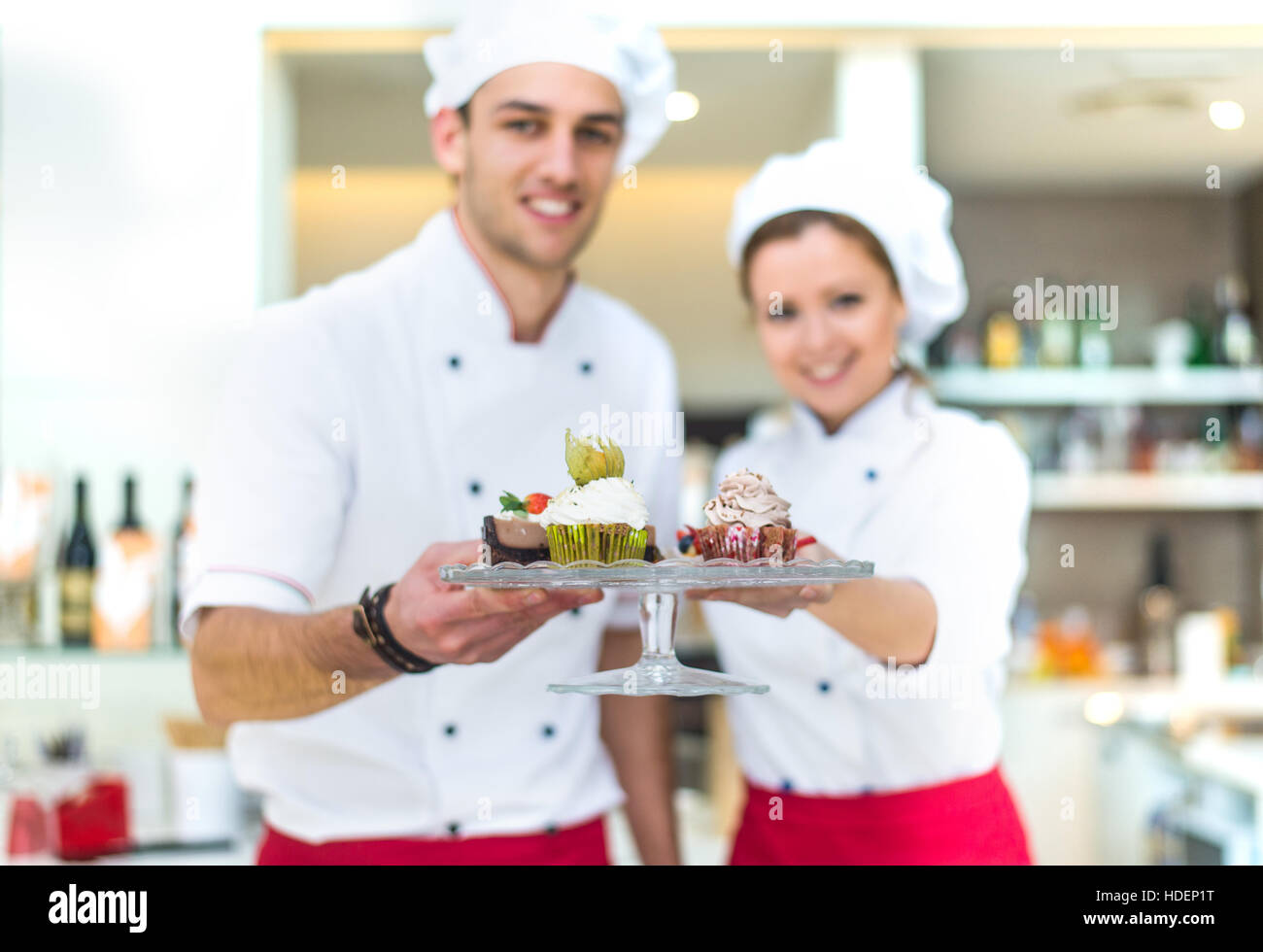 Two pastry chefs preparing desserts in a pastry shop Stock Photo - Alamy