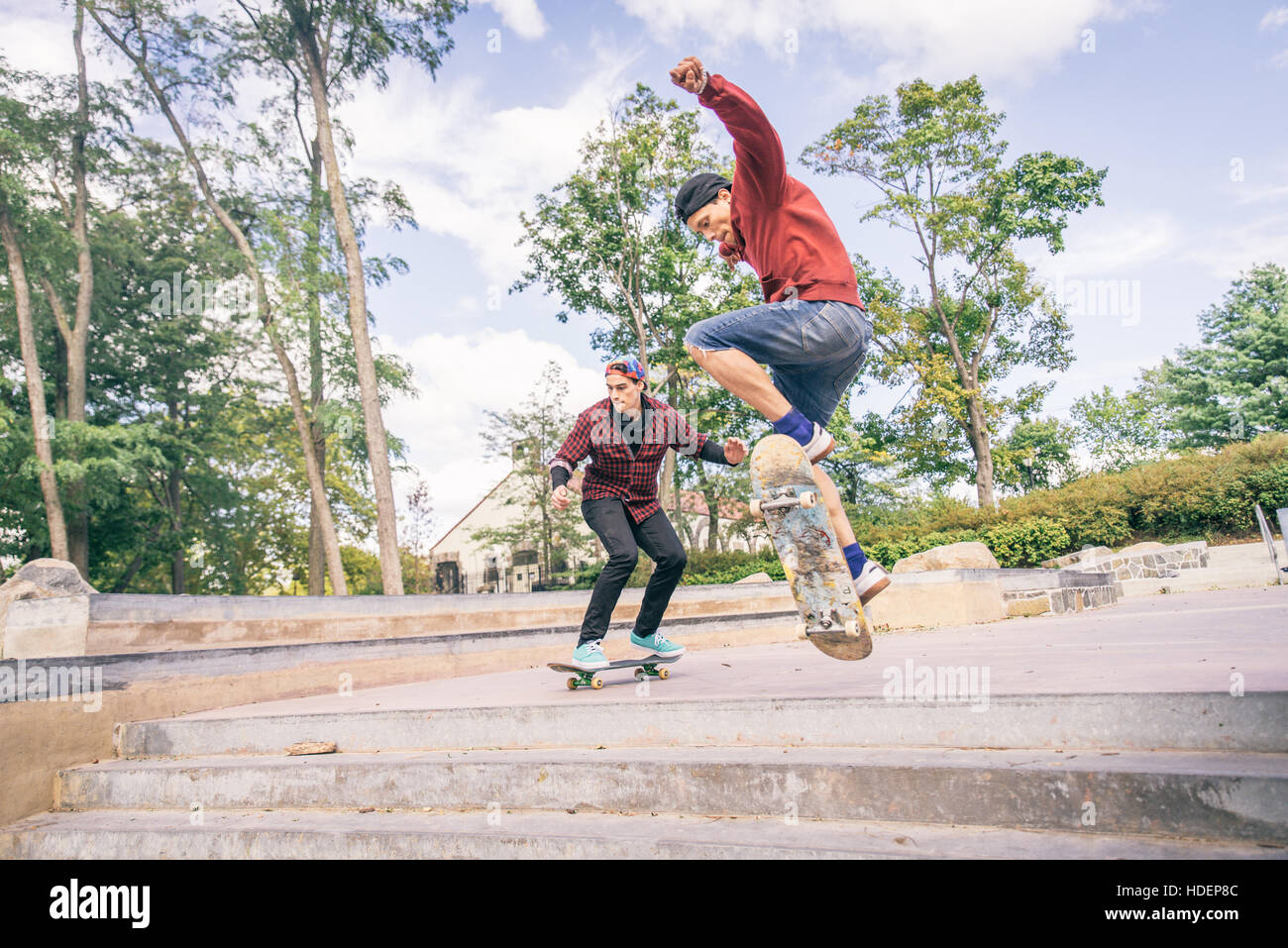 Young man jumping over railing hi-res stock photography and images - Alamy