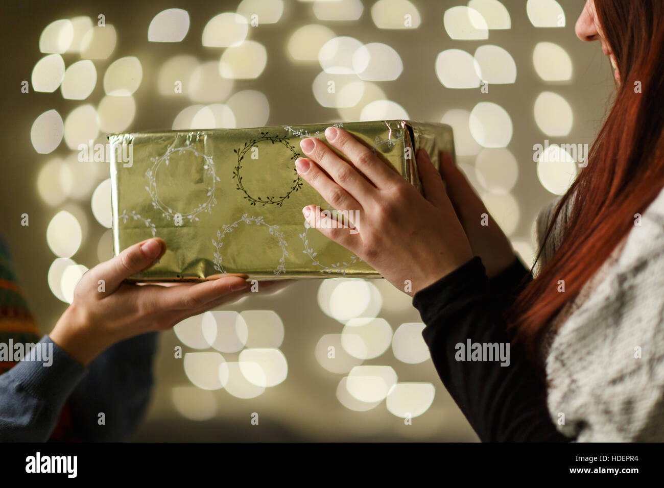 People hold present in box Stock Photo - Alamy