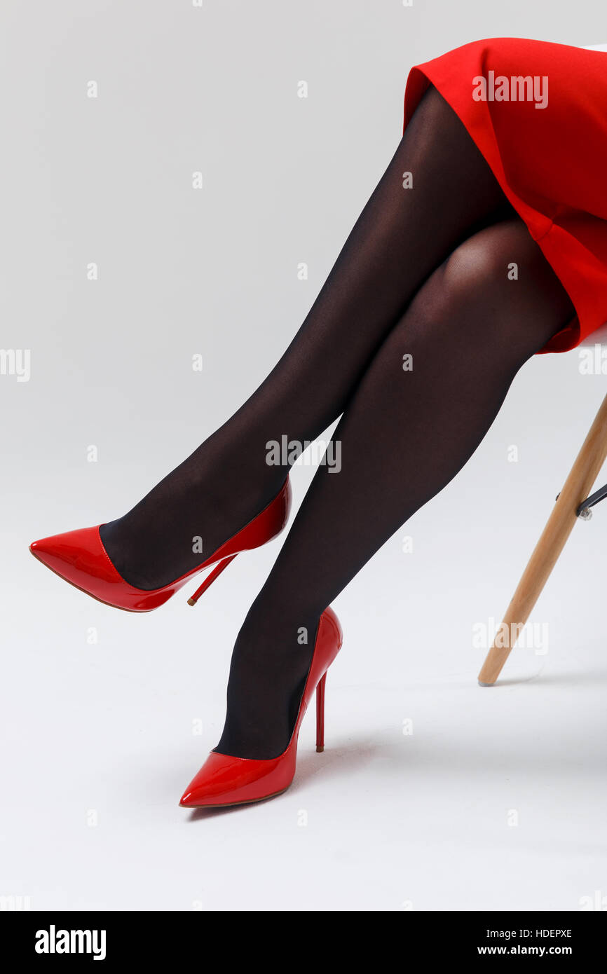 Girl in shoes on chair Stock Photo - Alamy