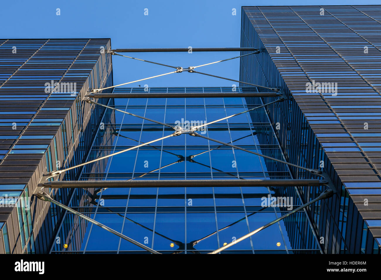 Glass and concrete architectural exteriors. Storeys and cable-stayed ...