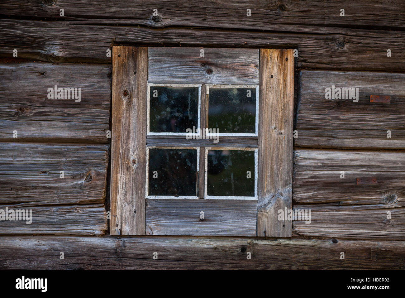 Square window of old one-storey wooden house in the North Stock Photo ...