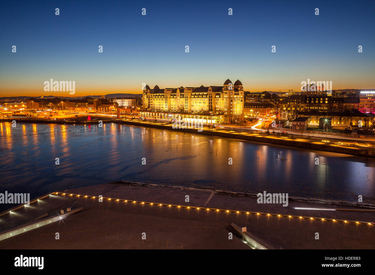 Evening view of the house on the city's waterfront, illuminated by ...