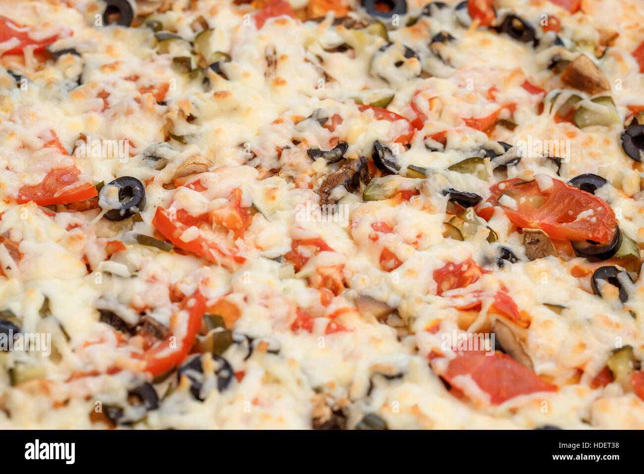 Cheeze pizza with tomatoes, closeup, macro Stock Photo - Alamy