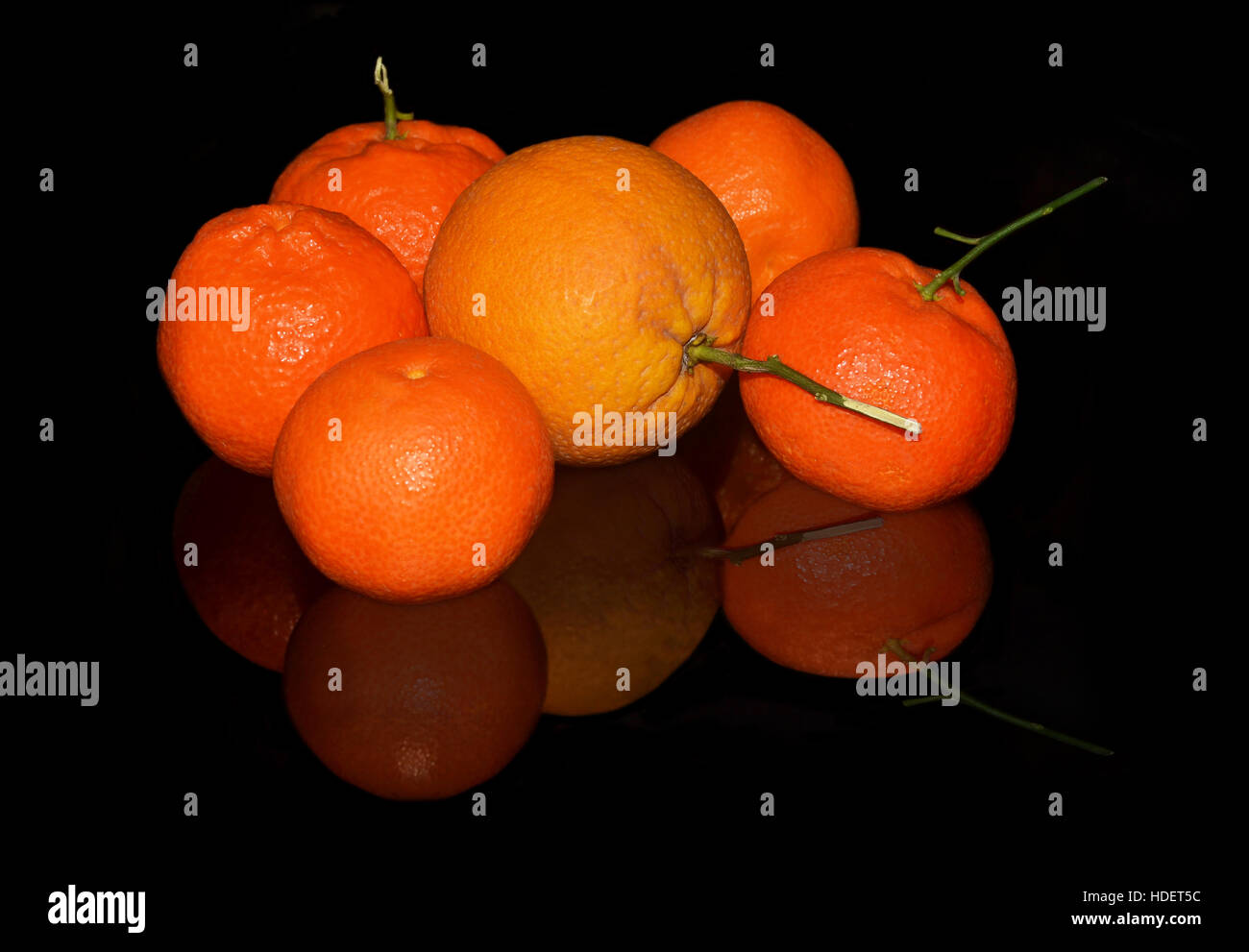 oranges and mandarins on black background Stock Photo - Alamy