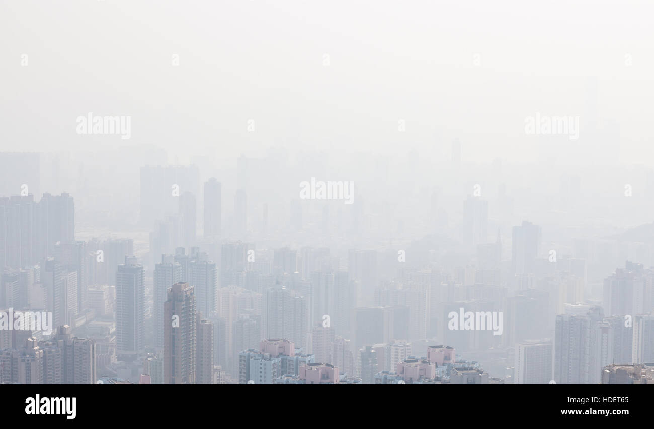 Hong kong tall buildings in haze Stock Photo - Alamy