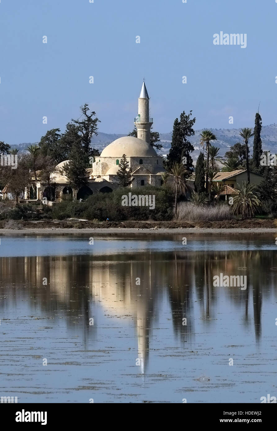 Hala Sultan Tekke Mosque reflected in the waters of the salt lake in ...
