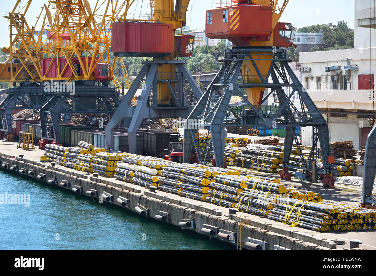 new pipes in the industrial port, cargo cranes and infrastructure Stock ...
