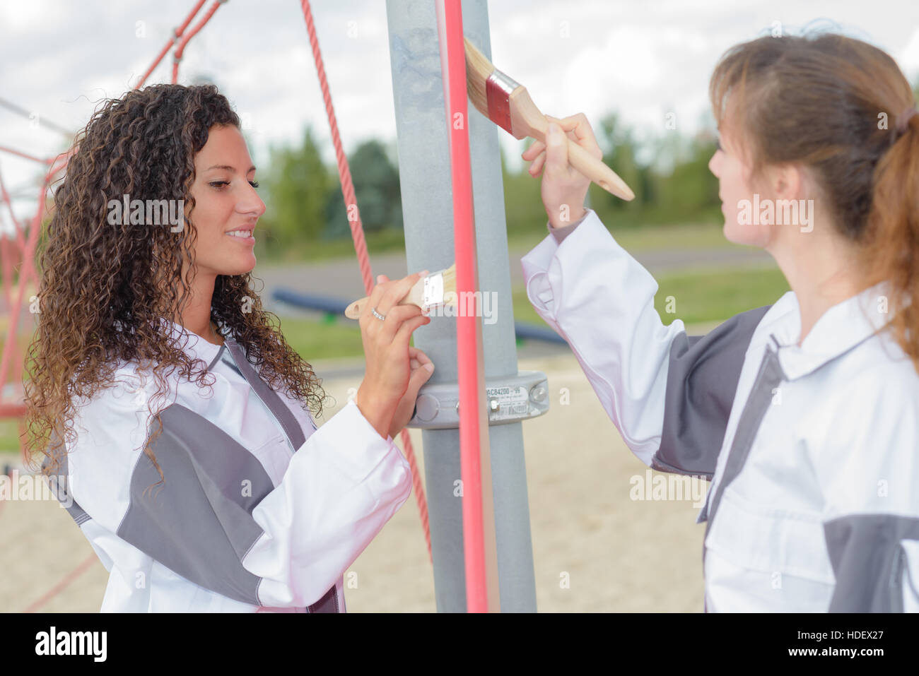 female painter painting Stock Photo - Alamy