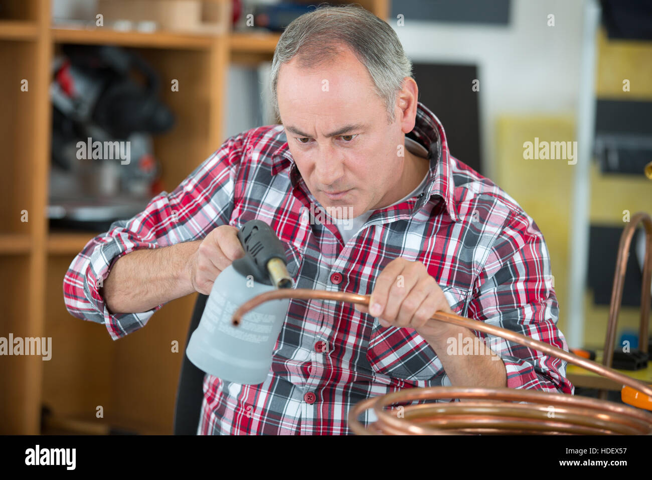 worker using a blowtorch Stock Photo - Alamy