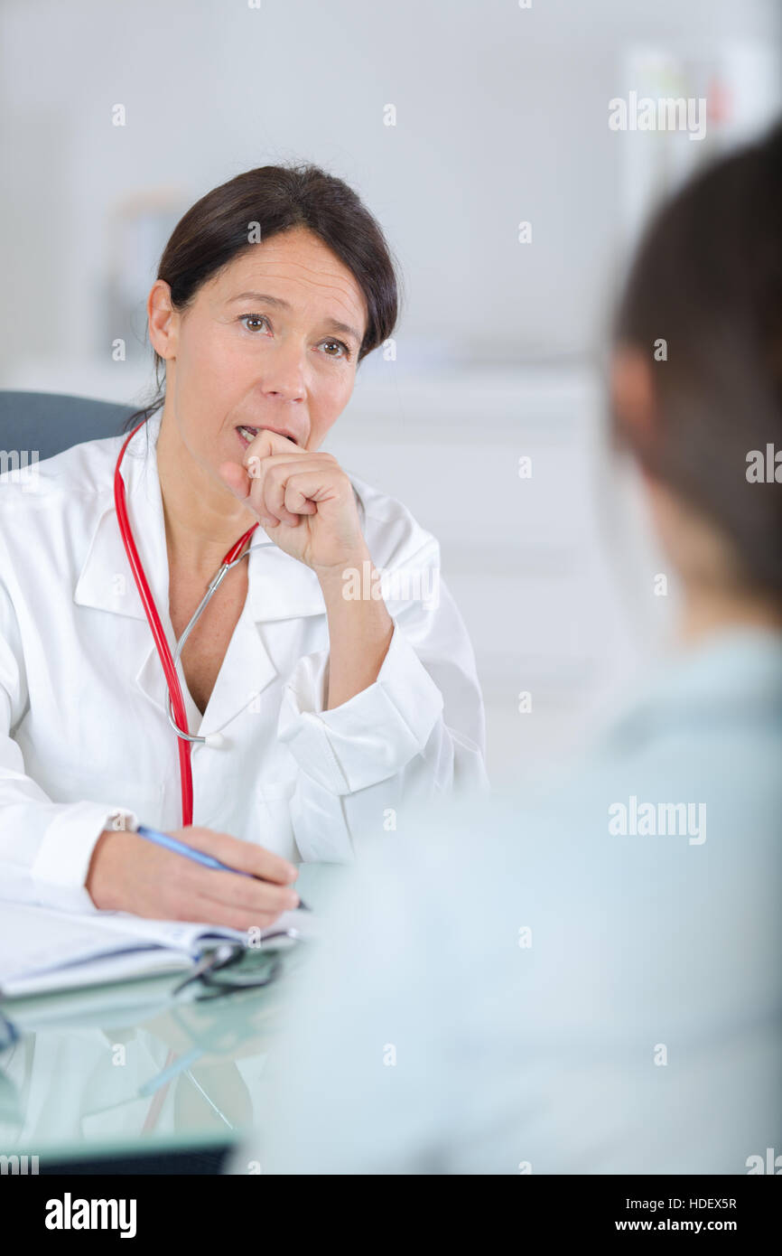 close up of patient and doctor taking notes Stock Photo - Alamy