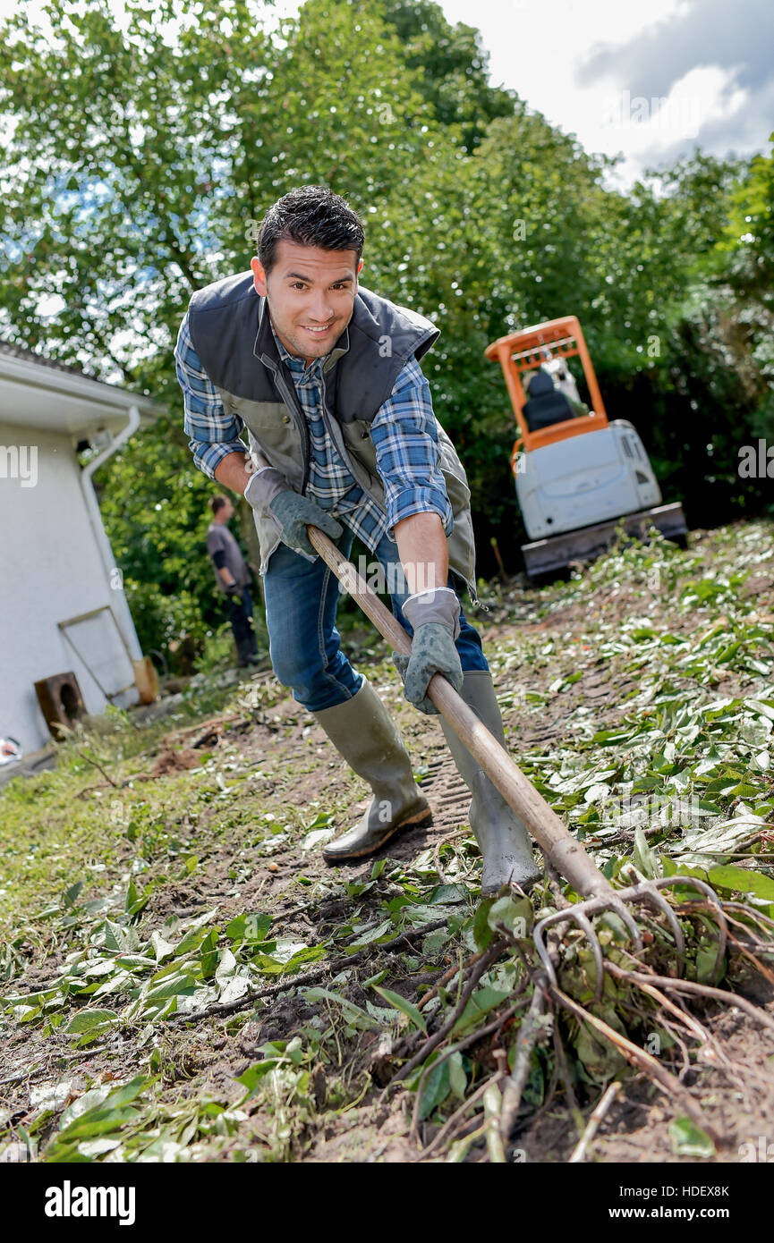 Gardener pile rake leaves hi-res stock photography and images - Alamy