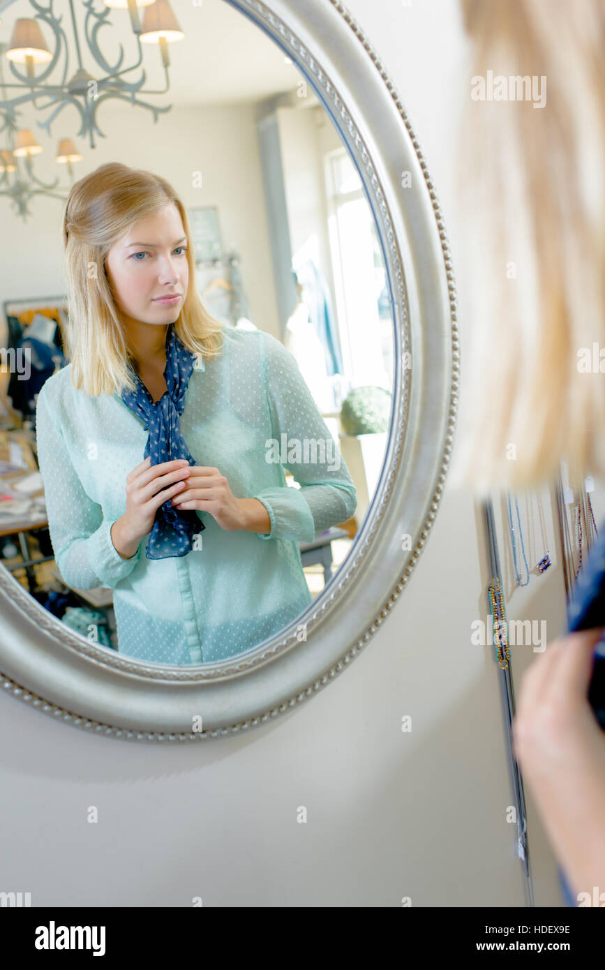 Lady wearing scarf, looking at reflection Stock Photo - Alamy