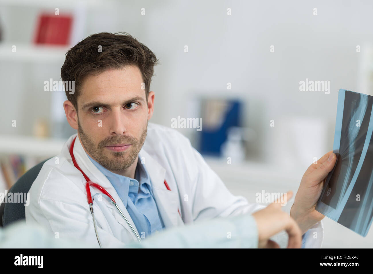 Nurses doctor examining male patient hi-res stock photography and ...