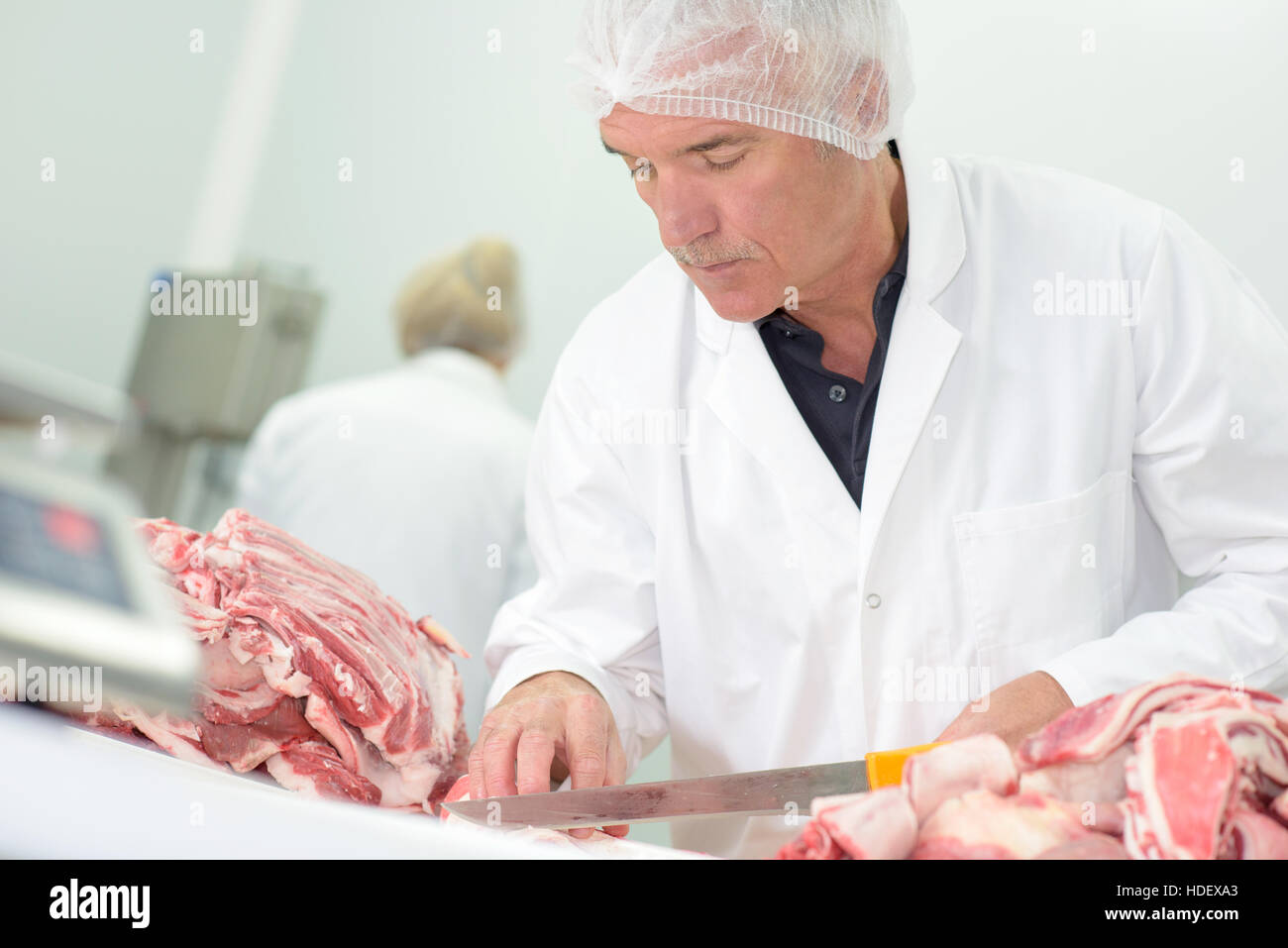 cutting red meat Stock Photo - Alamy