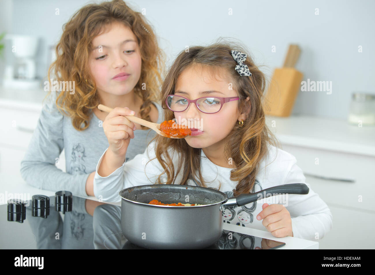 Two sisters cooking together Stock Photo - Alamy