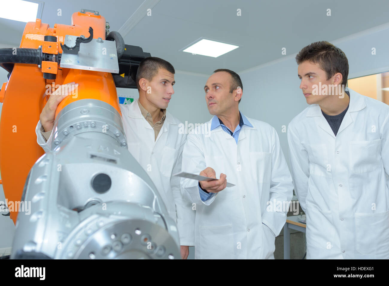 giving instructions to young apprentice Stock Photo - Alamy