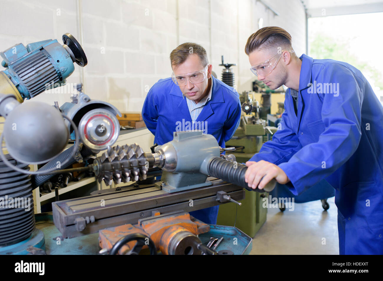 men testing a machine Stock Photo - Alamy
