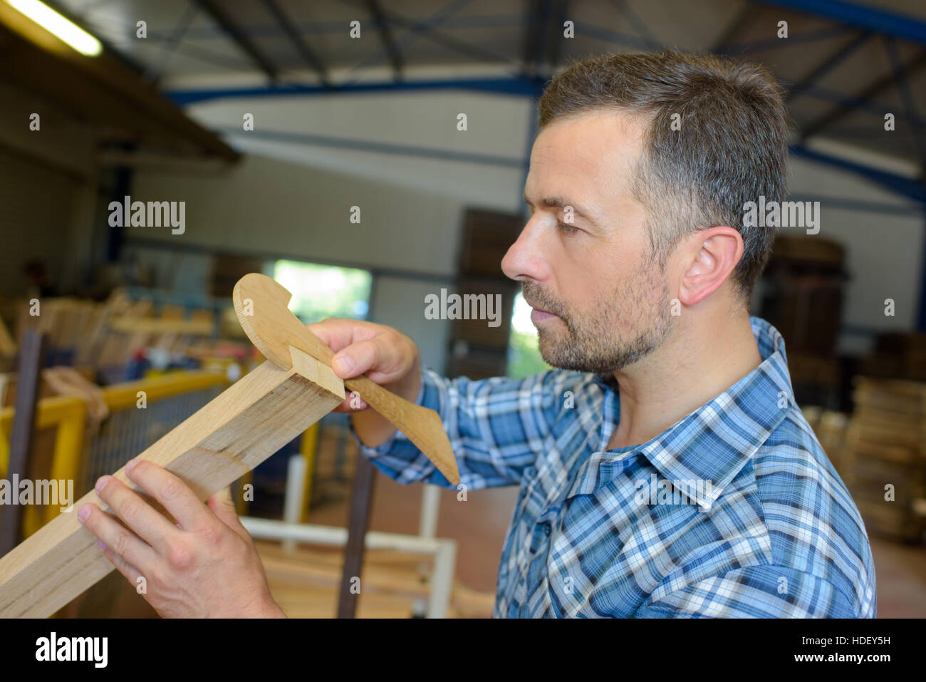 Carpenter measuring wood Stock Photo - Alamy