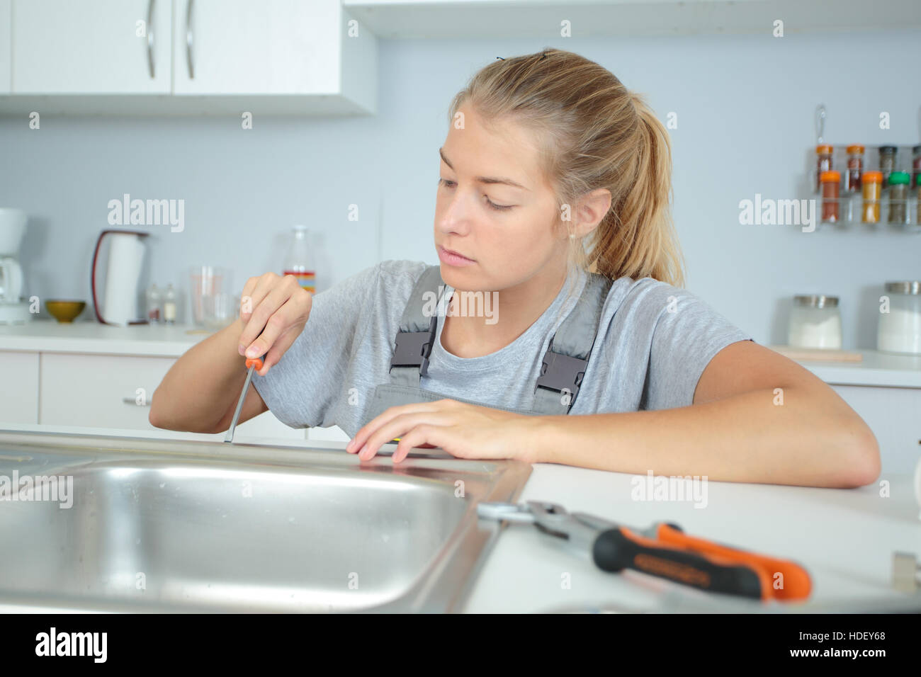 Unscrewing kitchen hi-res stock photography and images - Alamy
