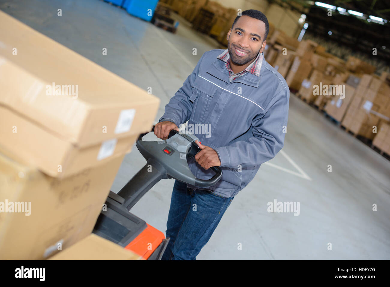 warehouse worker with pushcart Stock Photo - Alamy
