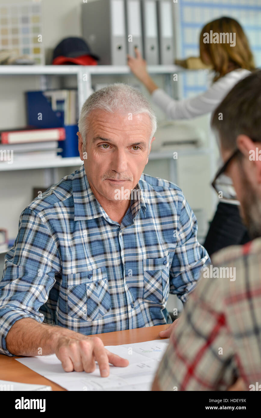 Architect with a client Stock Photo - Alamy