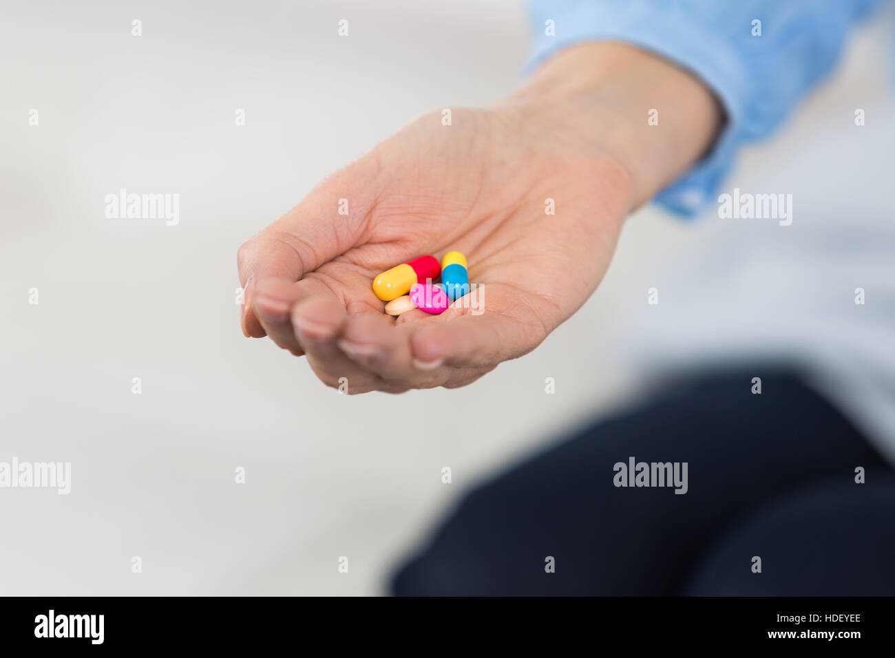 handfull of medicine help with cure Stock Photo - Alamy