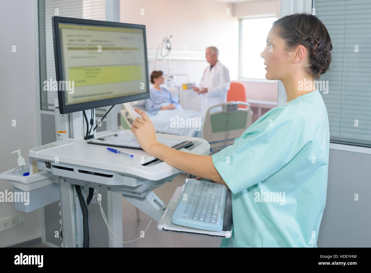 Nurse using computer Stock Photo - Alamy