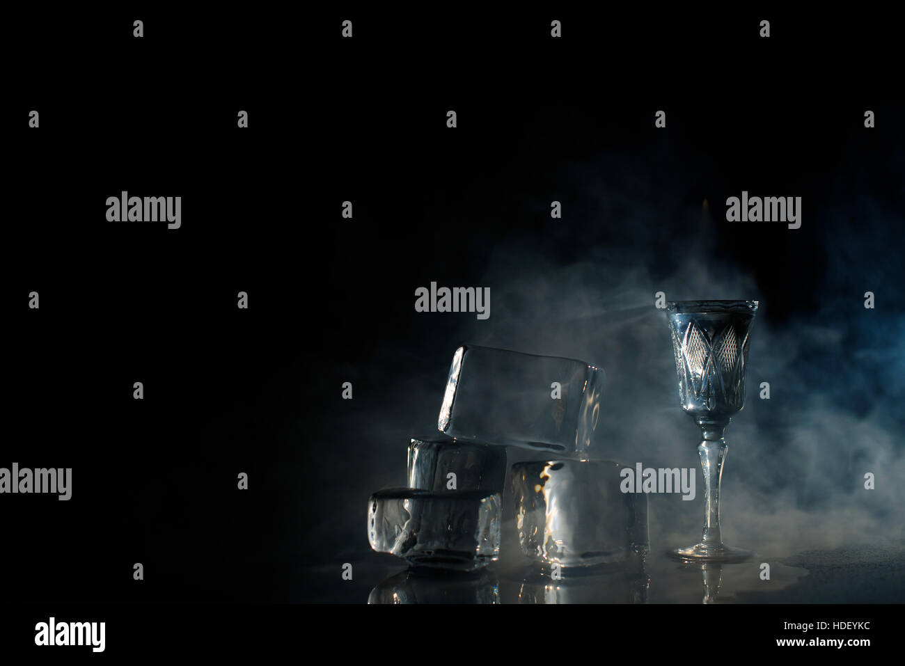 Ice cubes, flame and streams of smoke Stock Photo - Alamy