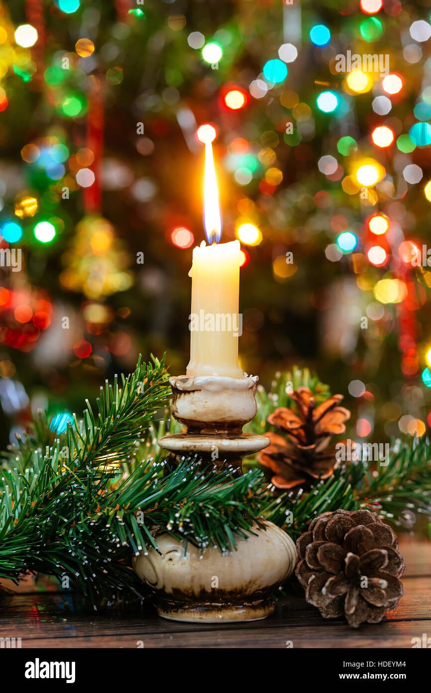 Burning candle on Christmas tree. Christmas tree candle lights Stock ...