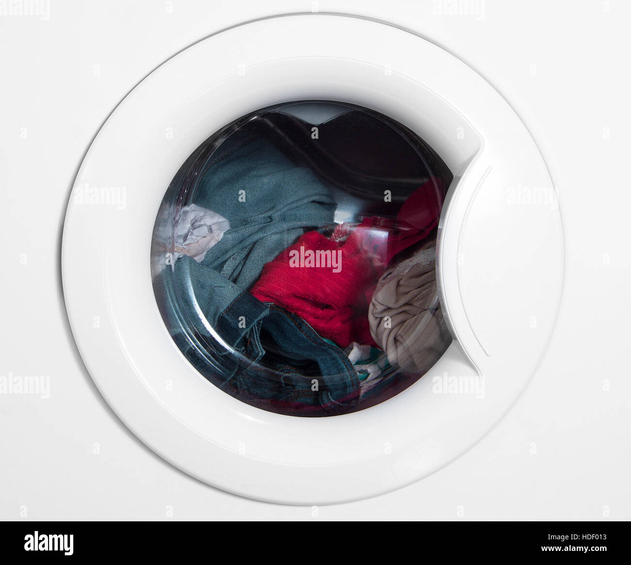 working washing machine with clothes Stock Photo - Alamy
