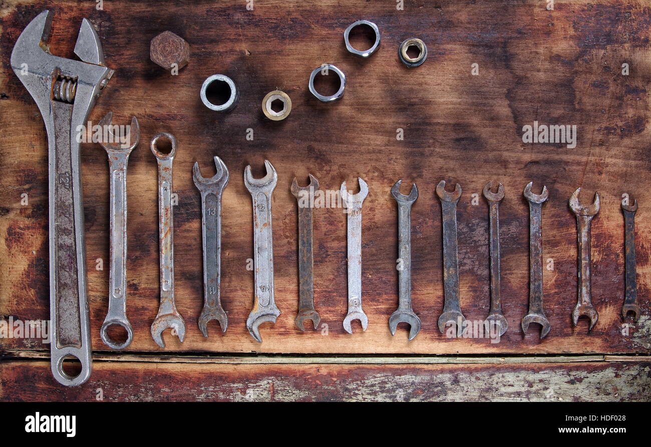 old dirty tools on table Stock Photo - Alamy