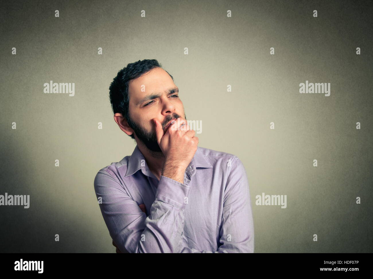 casual man with the beard thinking Stock Photo - Alamy