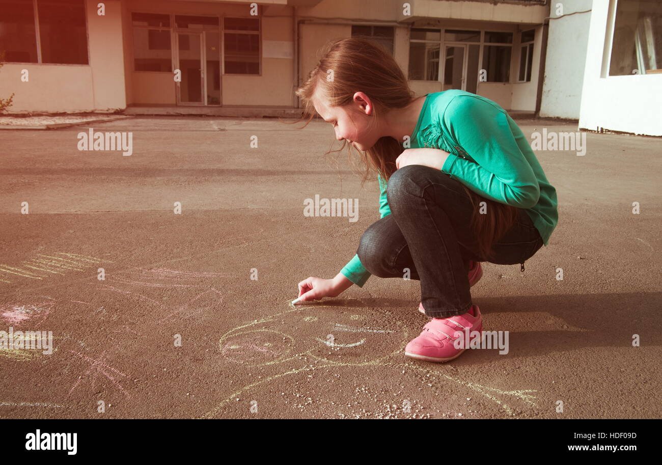 little girl is drawing outdoors Stock Photo - Alamy