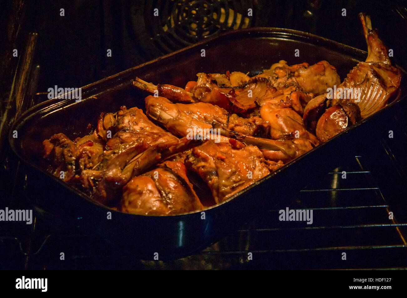 domestic rabbit, baking tin, pan, baked lean rabbit meat Stock Photo ...