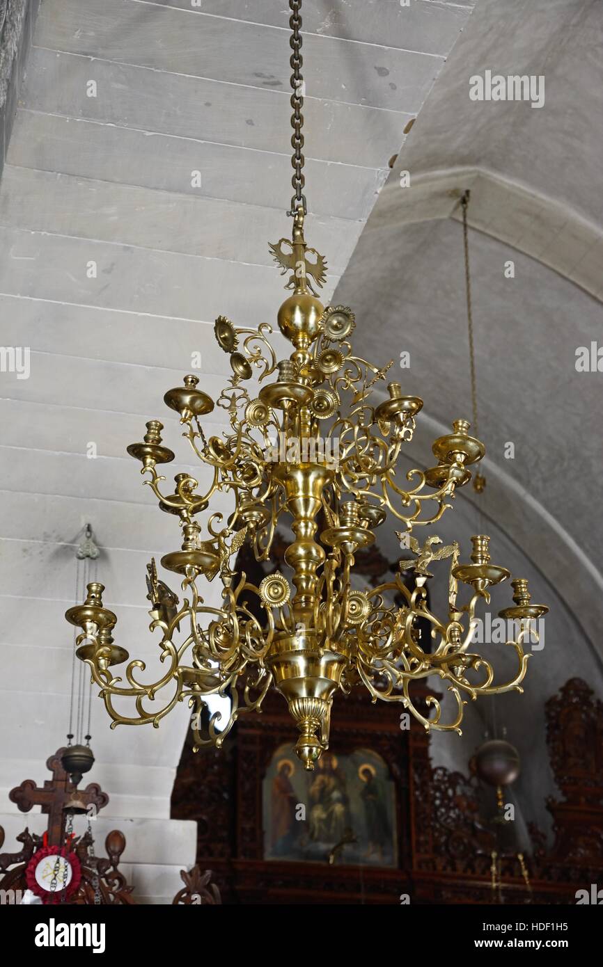 Ornate gold candle chandelier inside the Arkadi Monastery church ...