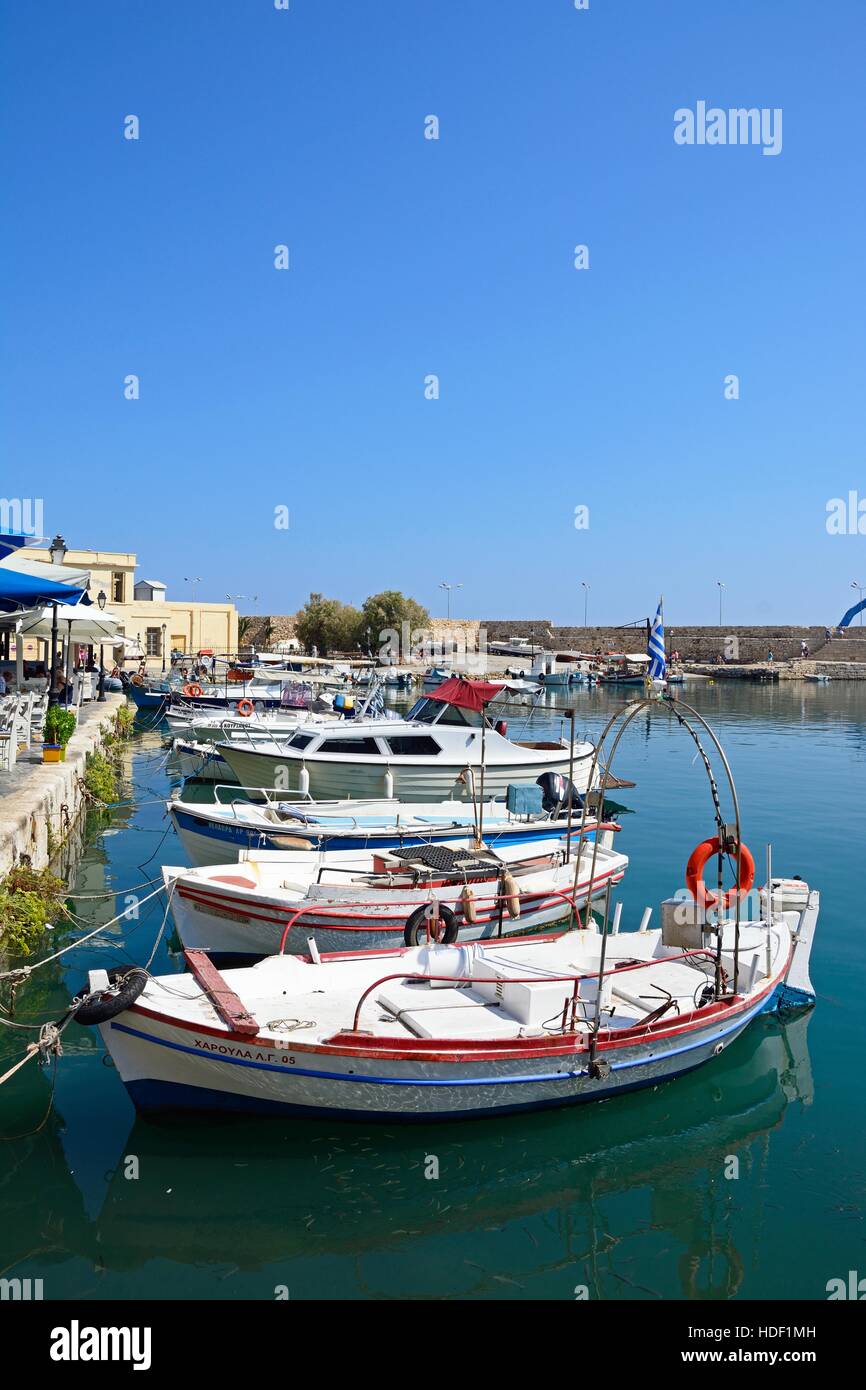 View of traditional fishing boats in the inner harbour with waterfront ...