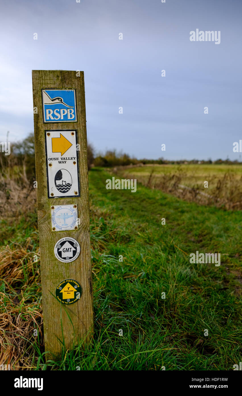 Nature trail and RSPB directional signs, seen on a wooden post but a ...