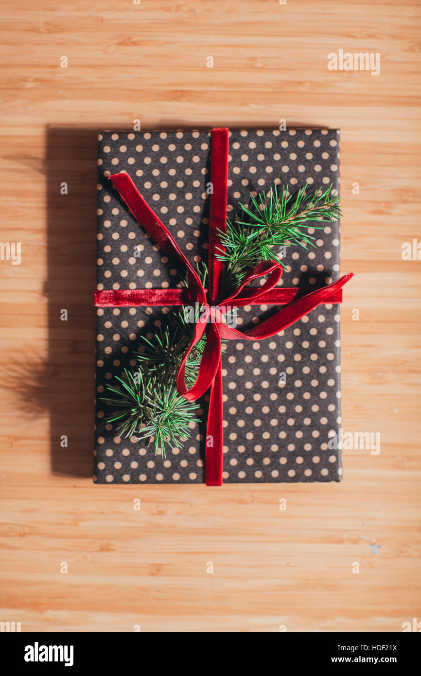 Beautifully wrapped Christmas present on table Stock Photo - Alamy