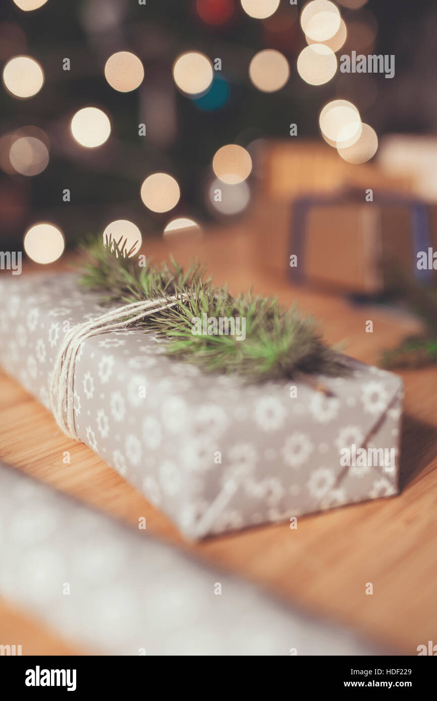 Beautifully wrapped Christmas present on table Stock Photo - Alamy