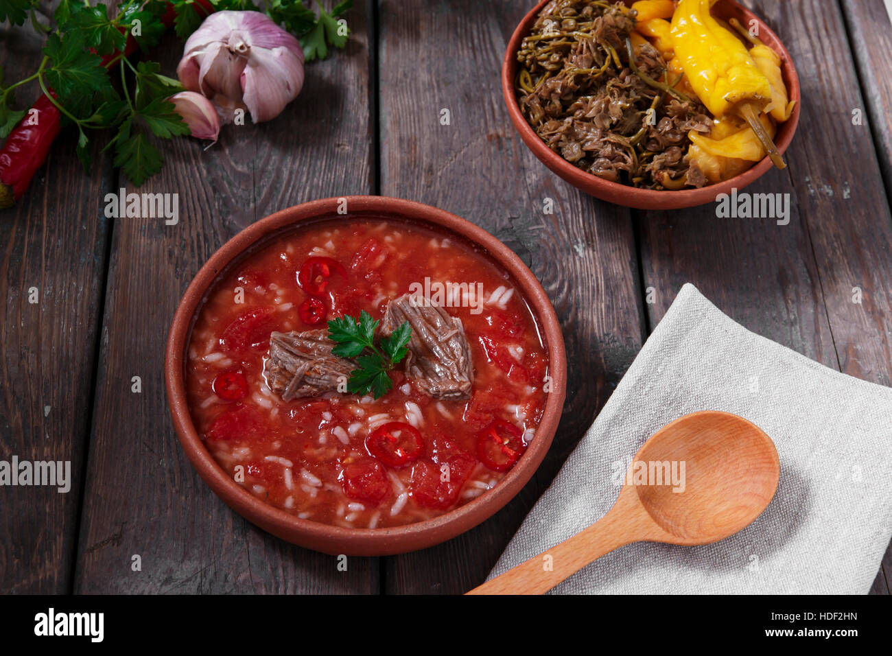 Traditional Georgian soup Kharcho with meat and rice in ceramic ware ...