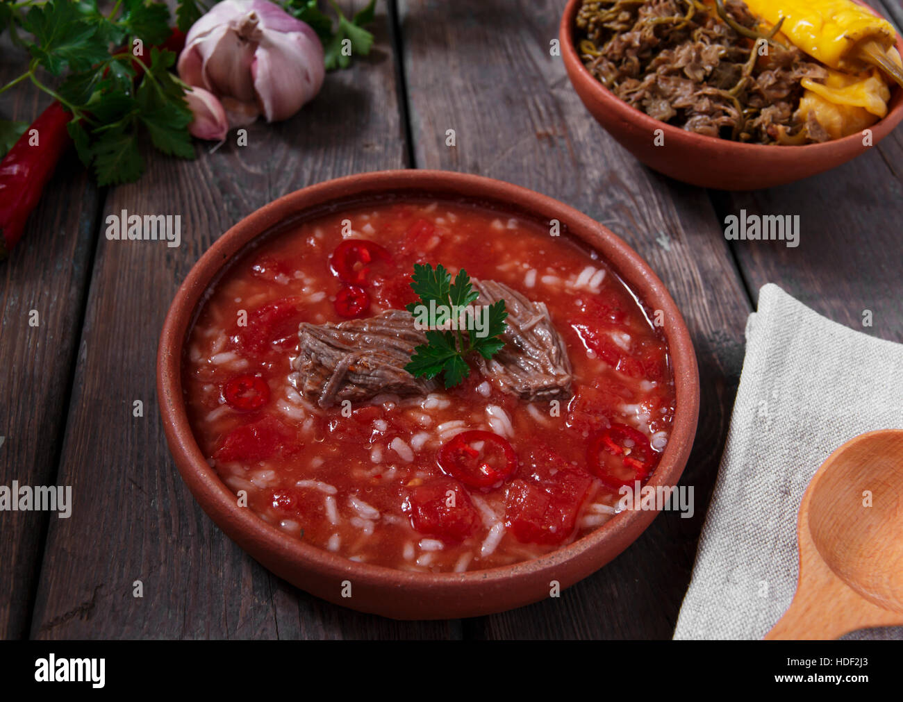 Traditional Georgian soup Kharcho with meat and rice in ceramic ware ...