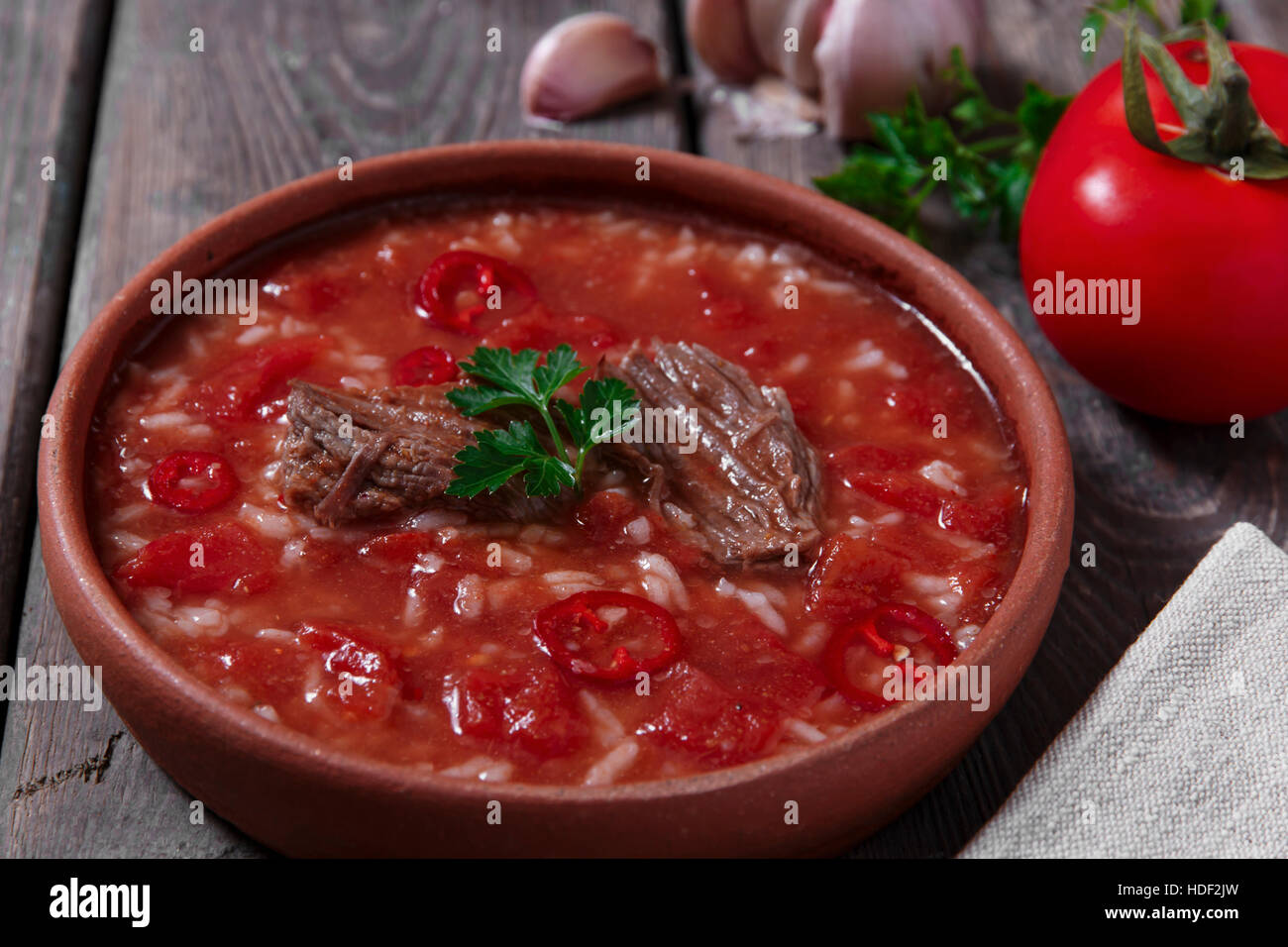 Traditional Georgian soup Kharcho with meat and rice in ceramic ware ...