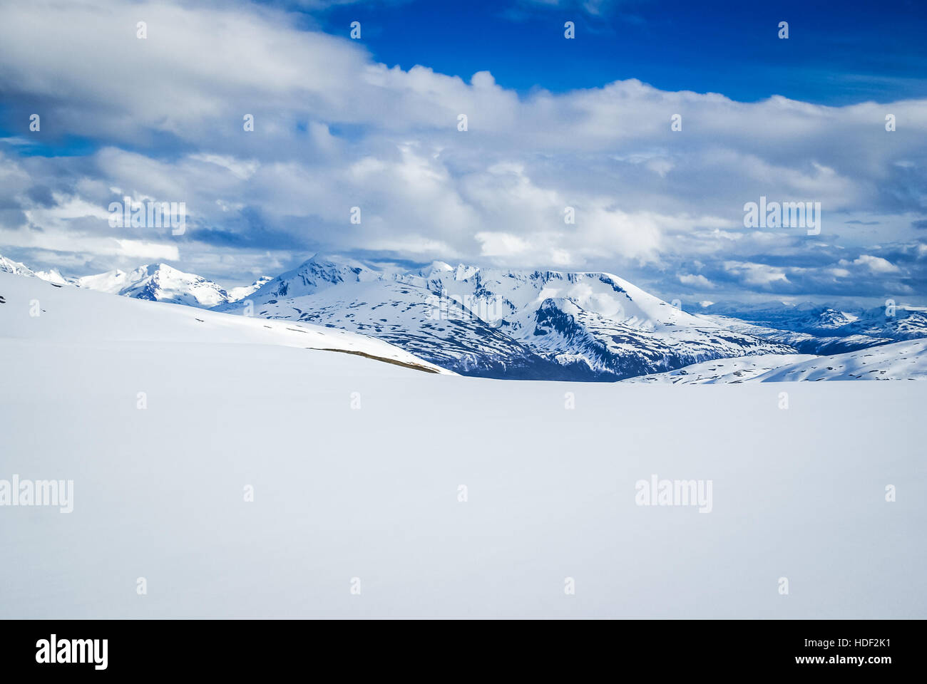 Photo of countryside and Tromsdalstinden mountain covered in snow ...