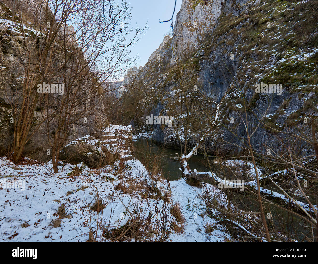 Winter landscape with a river in a mountain pass Stock Photo - Alamy