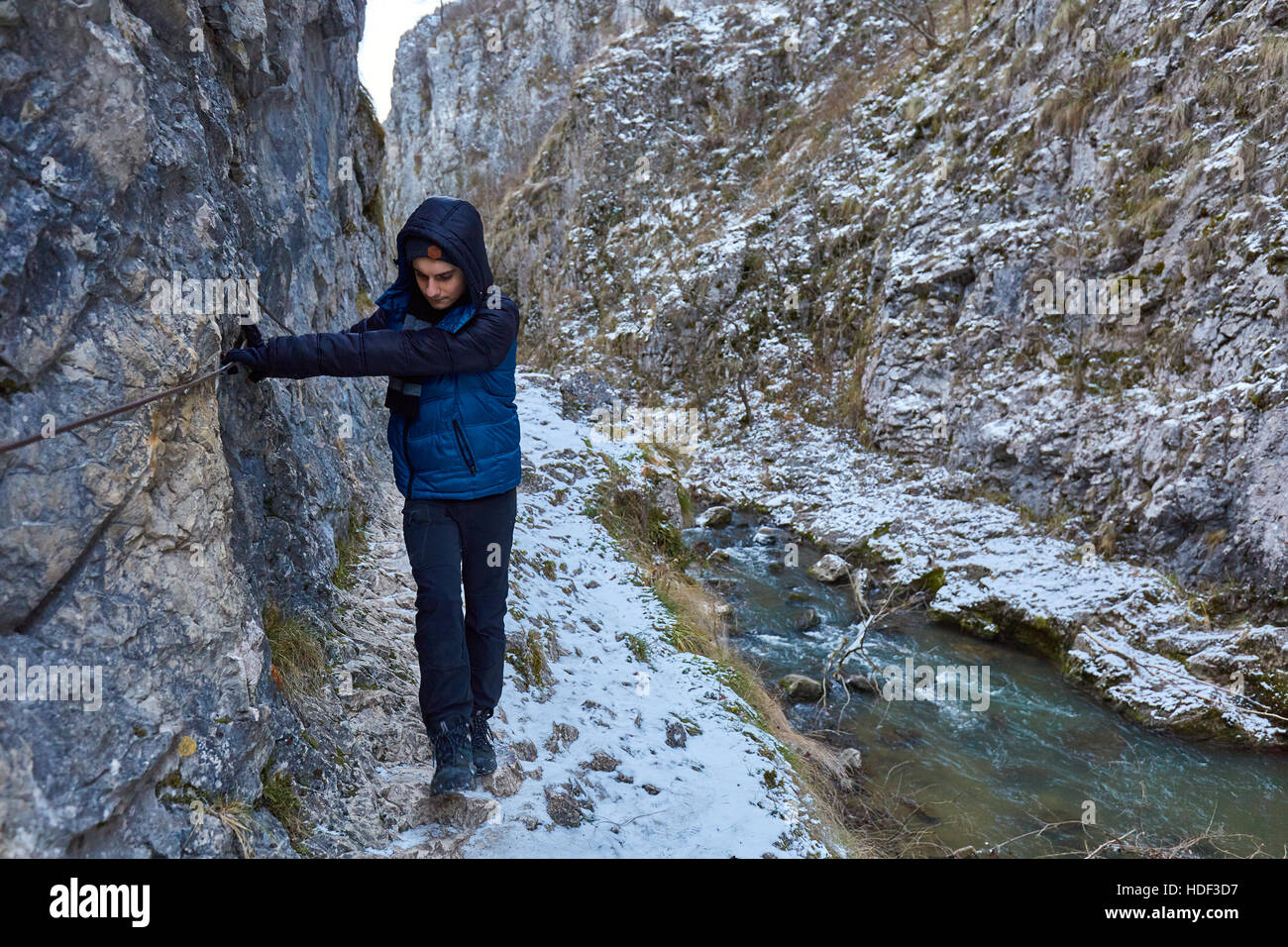 Teenage boy hiking on a mountain trail in winter Stock Photo - Alamy