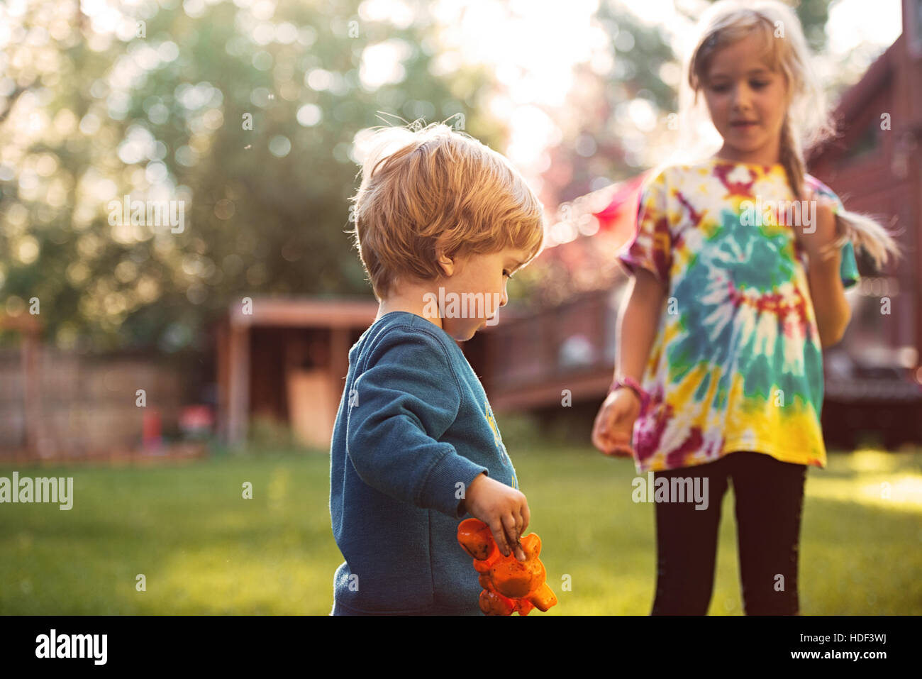 Pretty children on playground. from below image Stock Photo - Alamy
